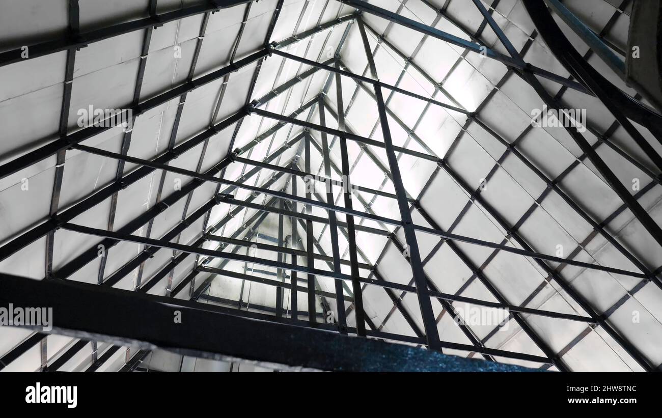 Triangular roof with iron beams. Stock footage. Bottom view of metal ...