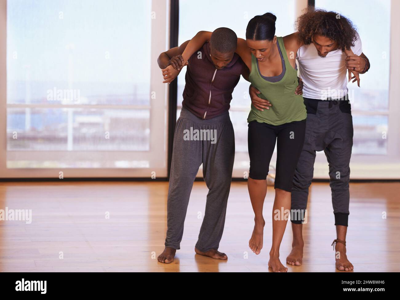 Friends and dance partners. Shot of a group of people practicing in a ...