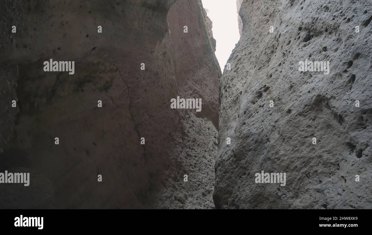 Narrow gorge in rocks. Action. Narrow passage between rocks in ...