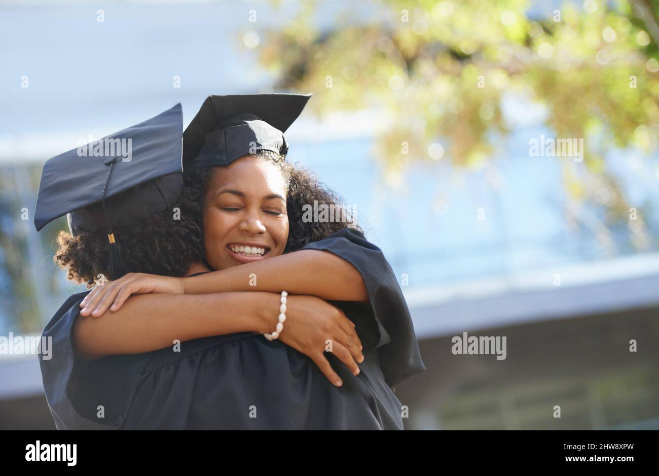 Graduation day. Outdoors shot of students on graduation day Stock Photo ...