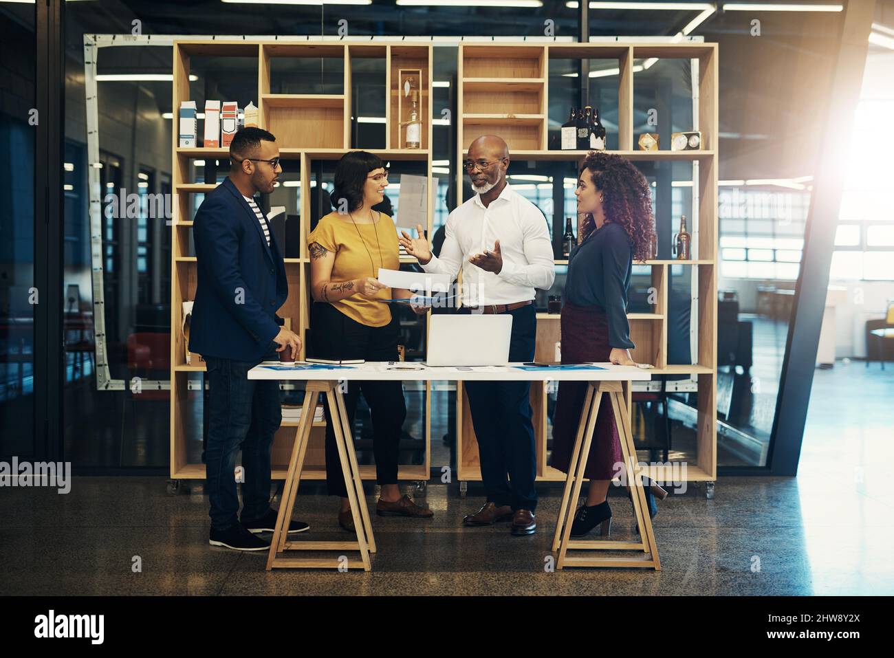 Planning brings everyone together. Shot of a group of designers having ...