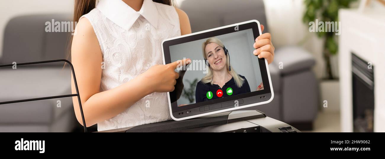 Little girl watching online lesson tutorial how to learn a synthesizer ...