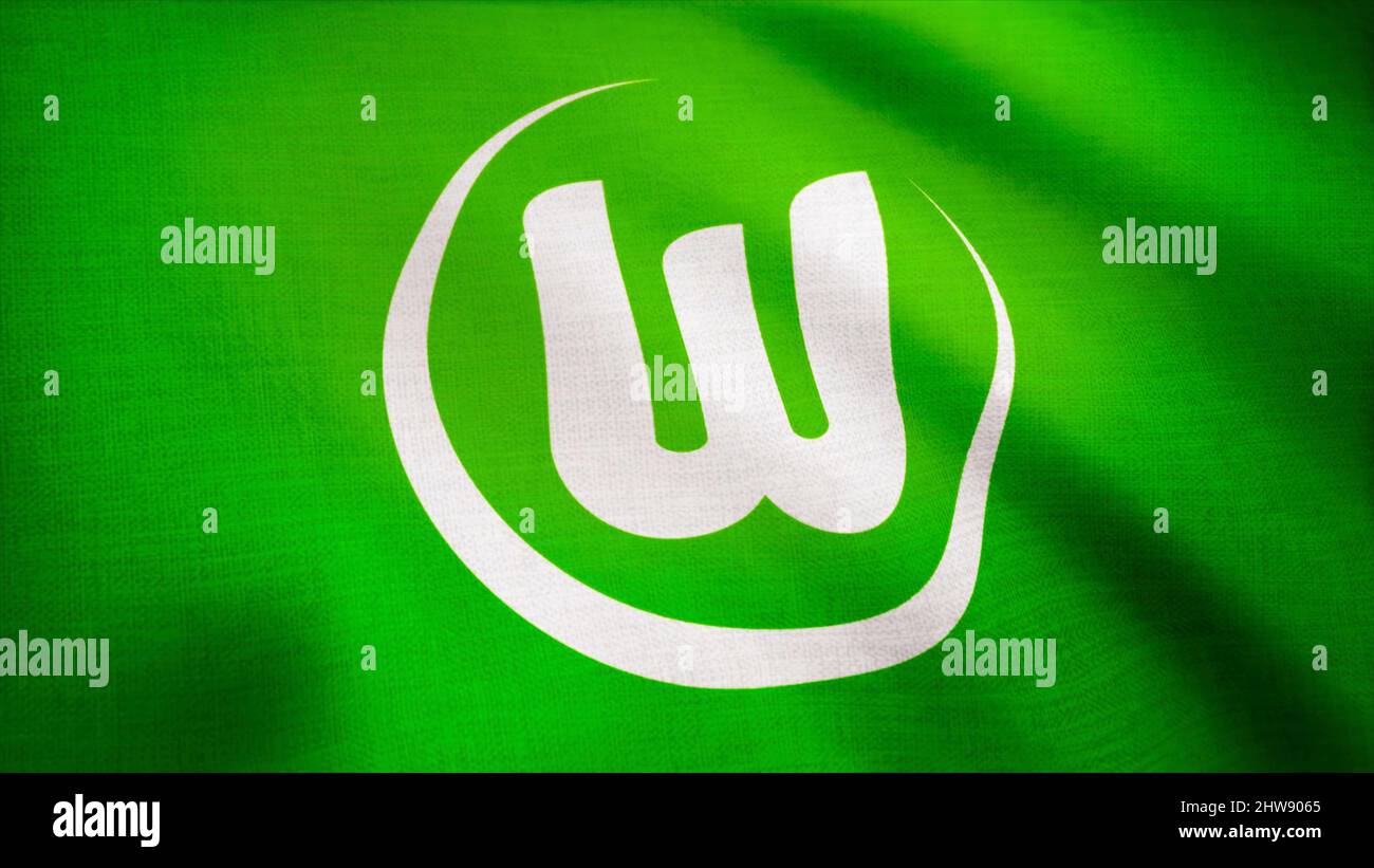Close-up of waving flag with FC Wolfsburg football club logo, seamless ...