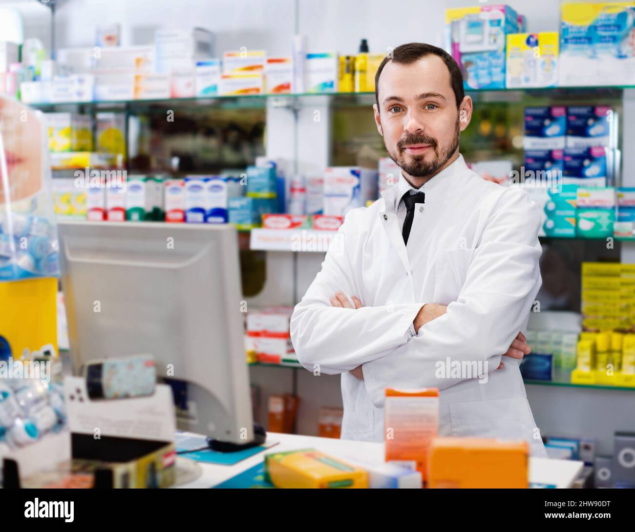 Male pharmacist demonstrating assortment of drugs Stock Photo - Alamy
