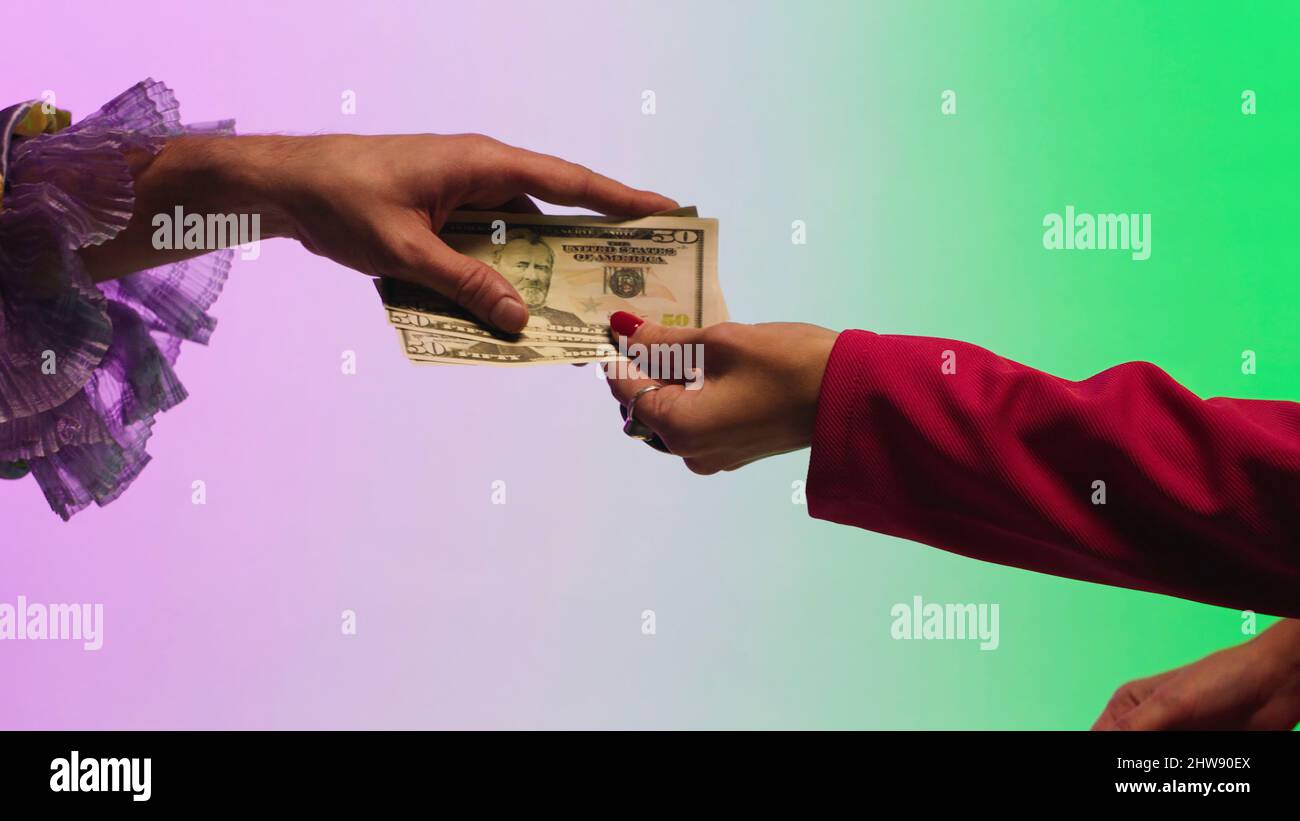 Woman is paying In cash with dollars banknotes. Stock. Traditional ...