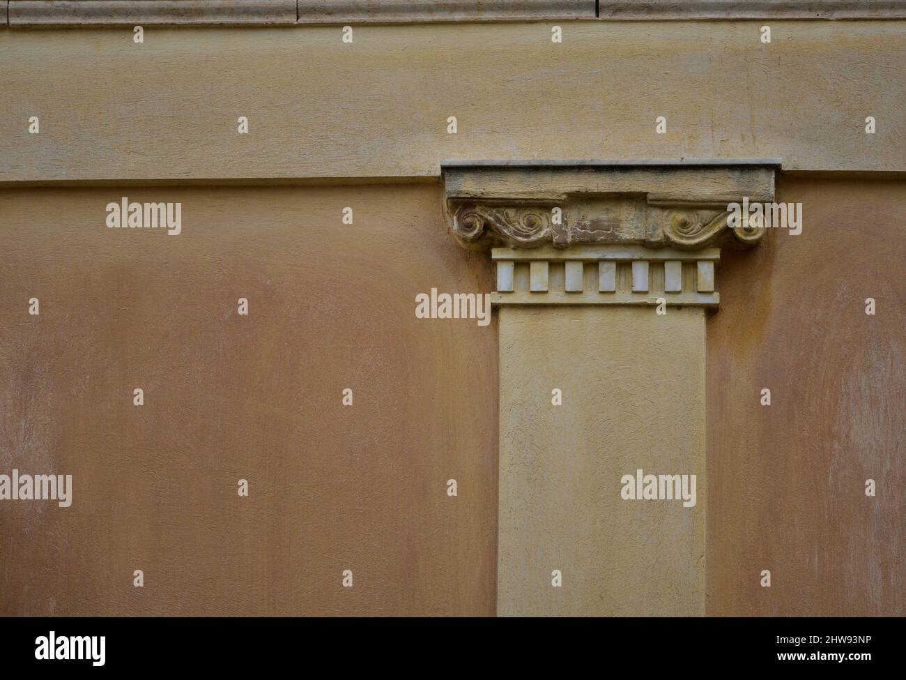 Old Neoclassical house facade with an Ionic order column against a ...