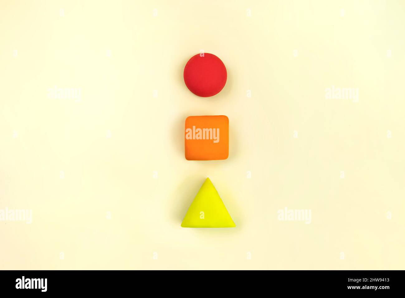 Geometric figures on yellow background. Circle, square and triangle ...