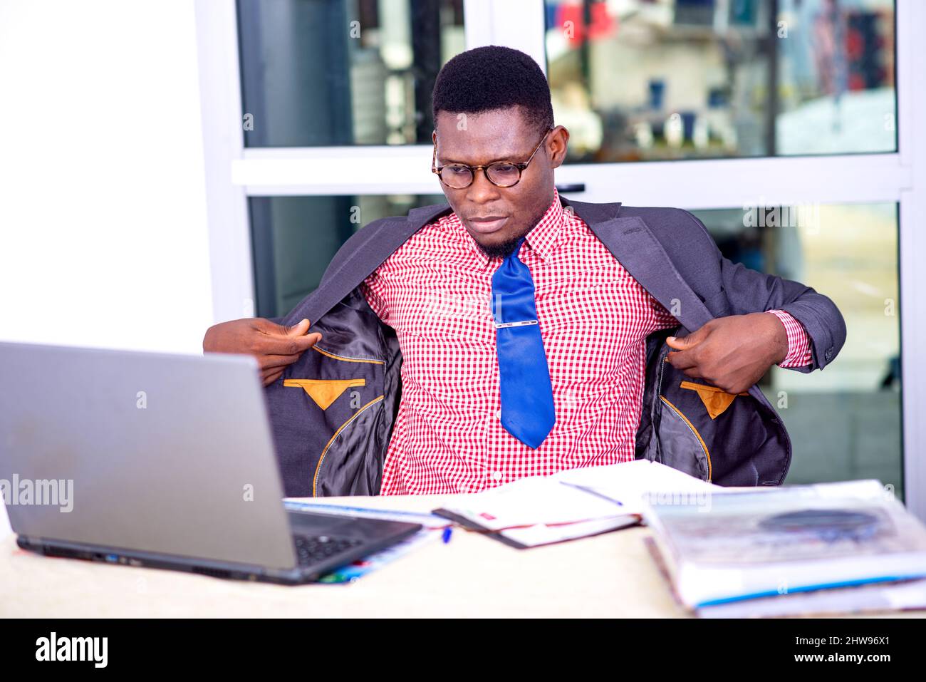 Man taking off jacket in hi-res stock photography and images - Alamy