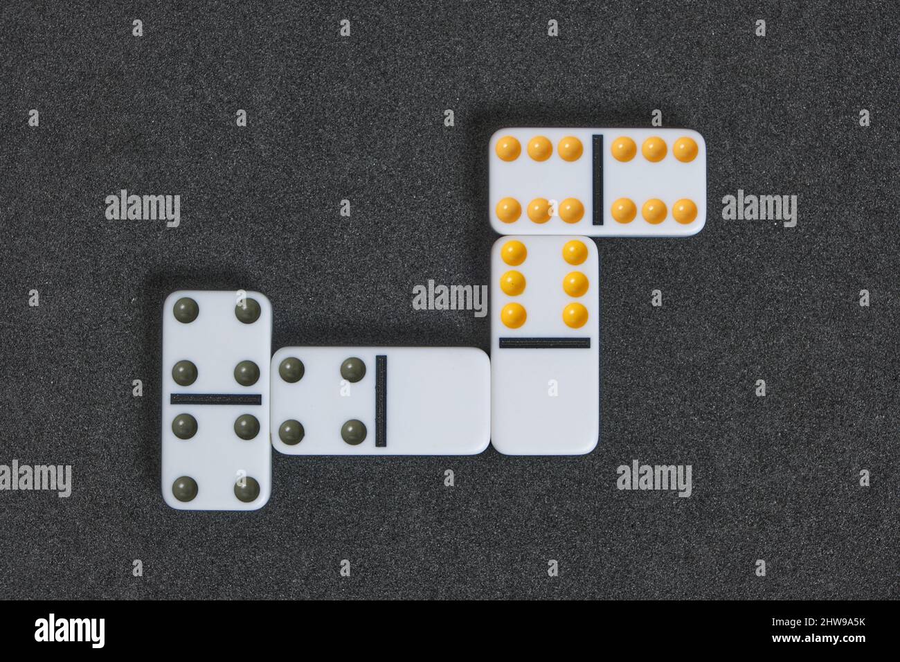 Domino chips gray background, board logic game Stock Photo - Alamy