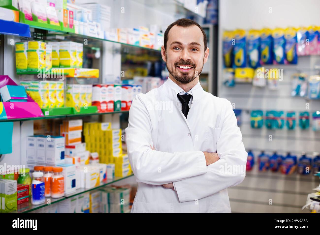 Male pharmacist demonstrating assortment of drugs Stock Photo - Alamy