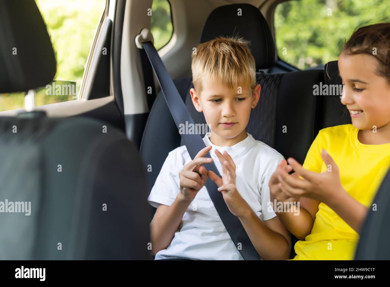 Cute children in car, boy and girl in the car Stock Photo - Alamy
