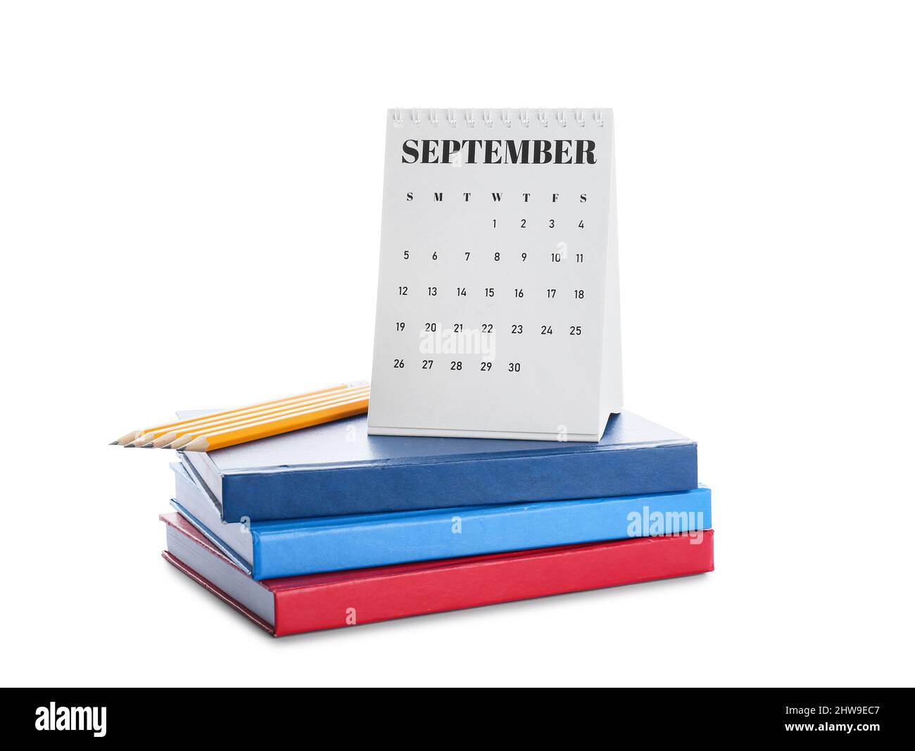 Stack of notebooks, pencils and calendar on white background Stock ...