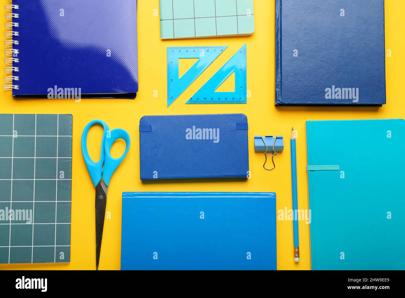 Set of colorful stationery on yellow background Stock Photo - Alamy