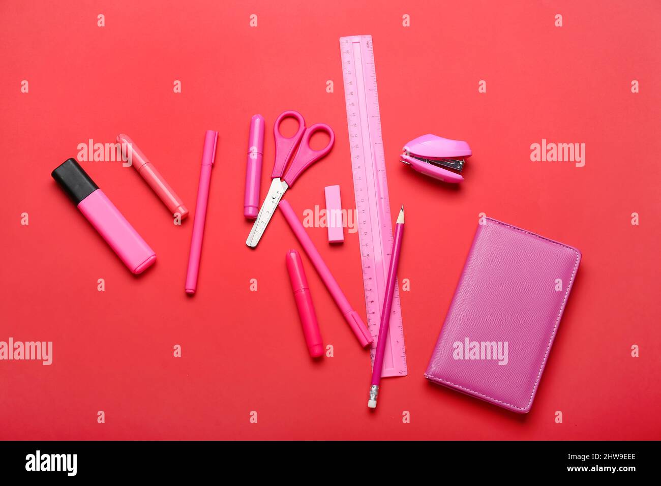Set of different stationery on red background Stock Photo - Alamy