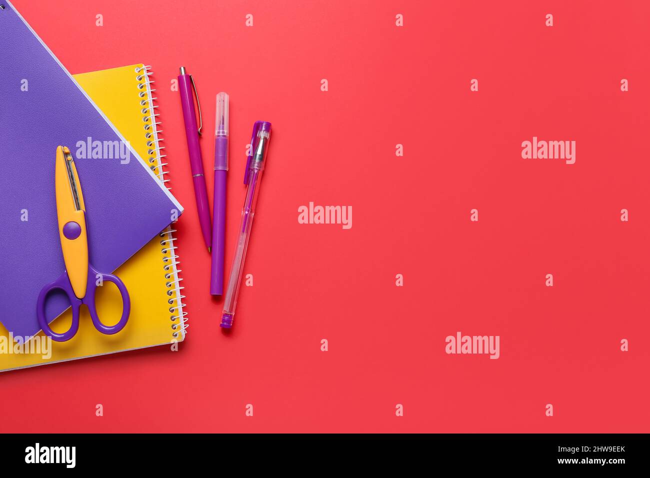 Set of different stationery on red background Stock Photo - Alamy