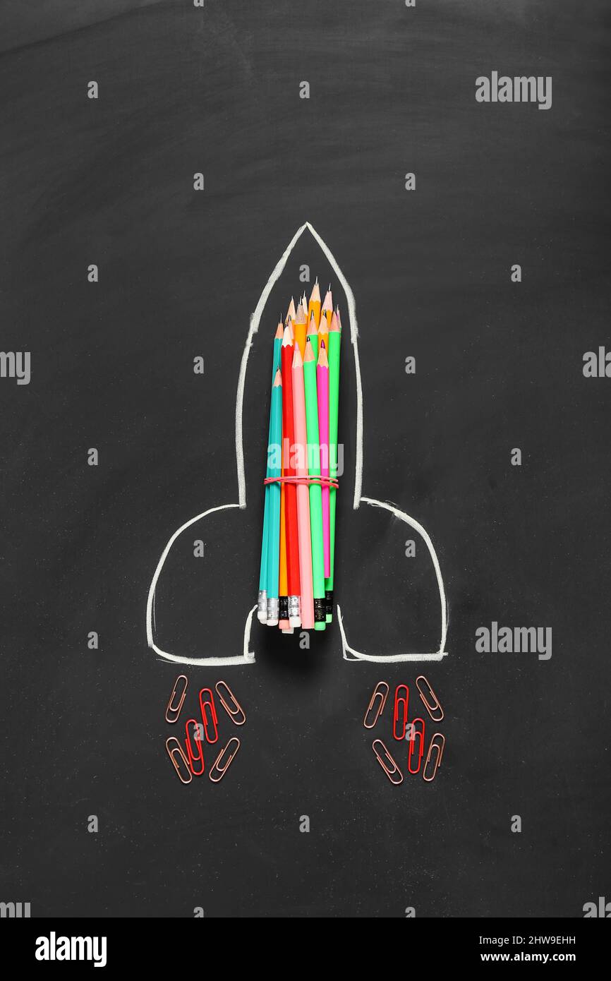 Creative composition with pencils and clips on dark background Stock ...