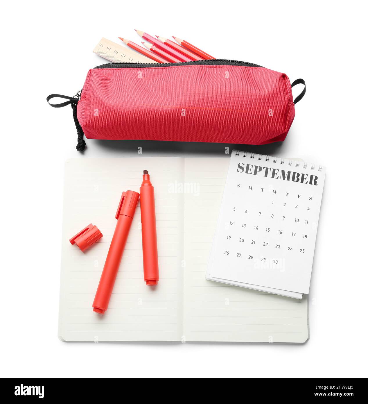 Composition with notebook, calendar, markers and pencil case on white ...