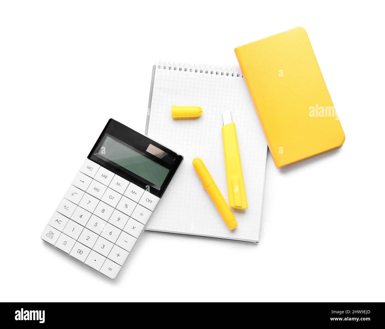 Calculator, notebooks and marker on white background Stock Photo - Alamy