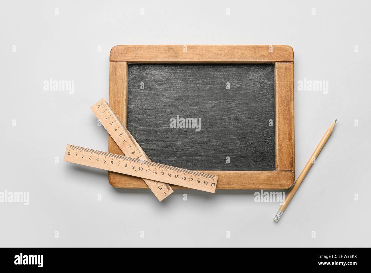 Blank chalkboard, rulers and pencil on grey background Stock Photo - Alamy