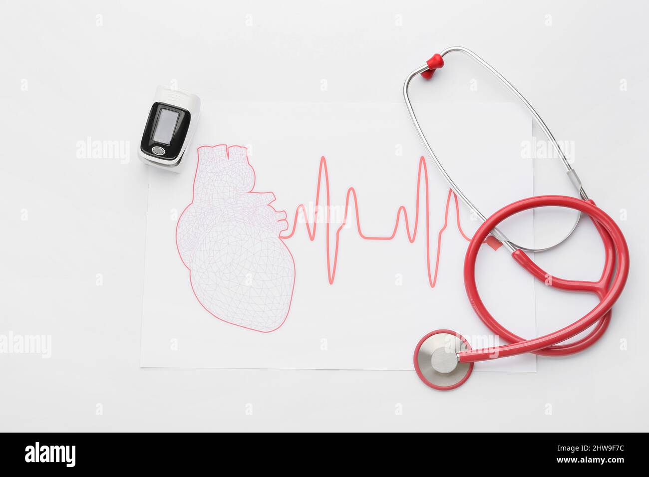Pulse oximeter, cardiogram and stethoscope on white background Stock ...