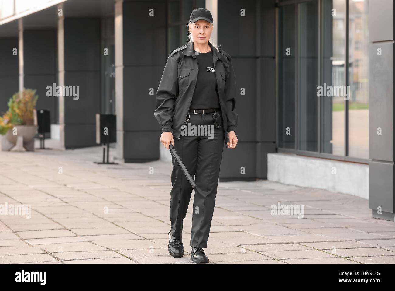 Female security guard outdoors Stock Photo - Alamy