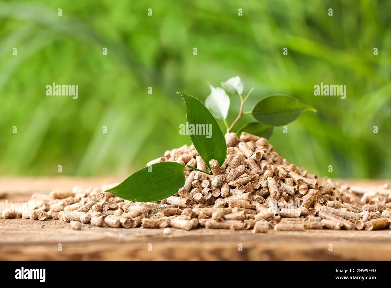 Pile of wood pellets on table outdoors Stock Photo - Alamy