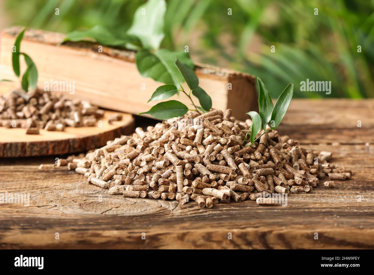 Pile of wood pellets on table outdoors Stock Photo - Alamy