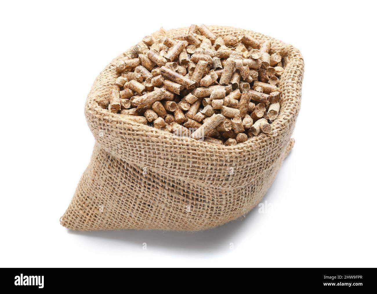 Sack with wood pellets on white background Stock Photo - Alamy