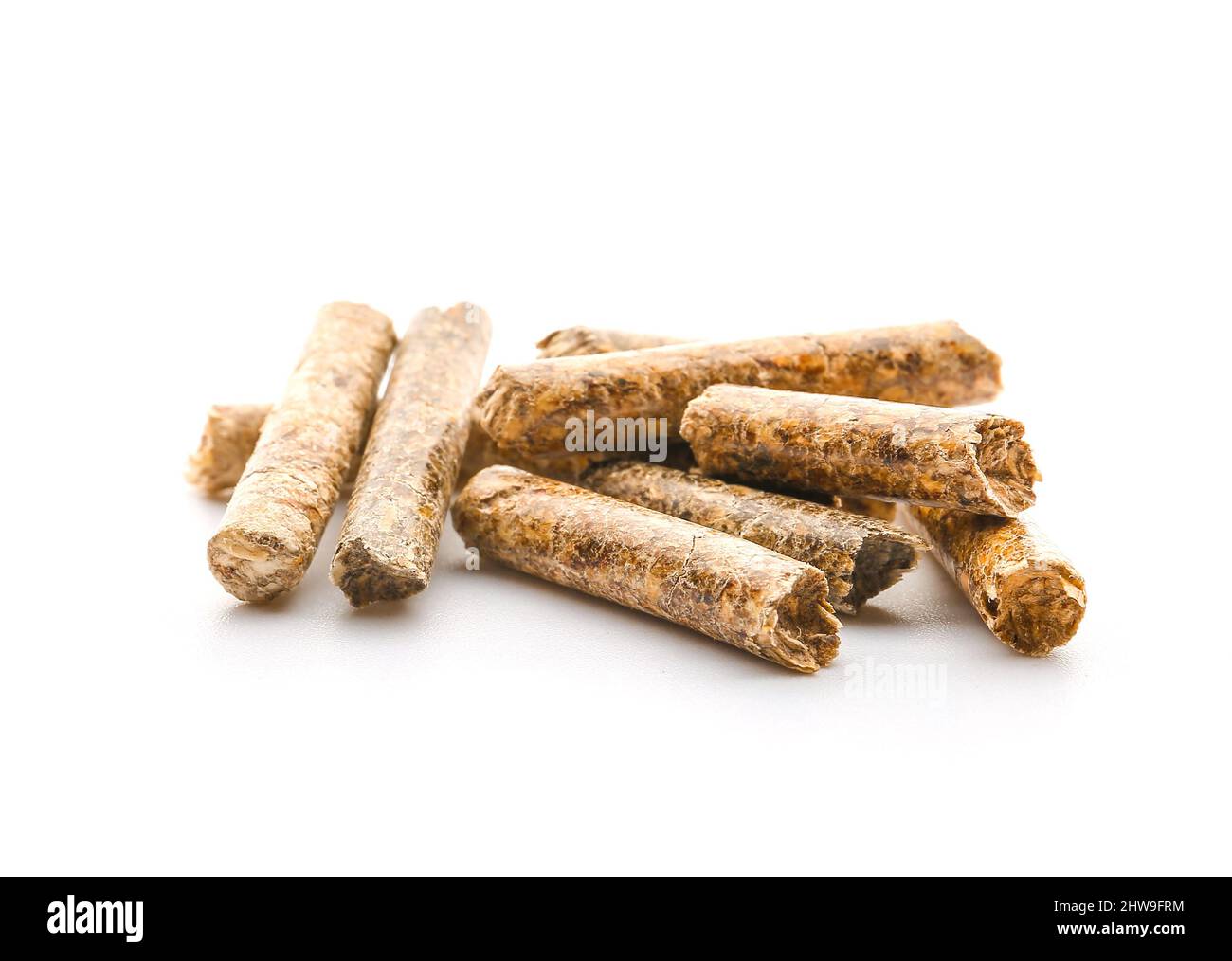 Wood pellets on white background Stock Photo - Alamy