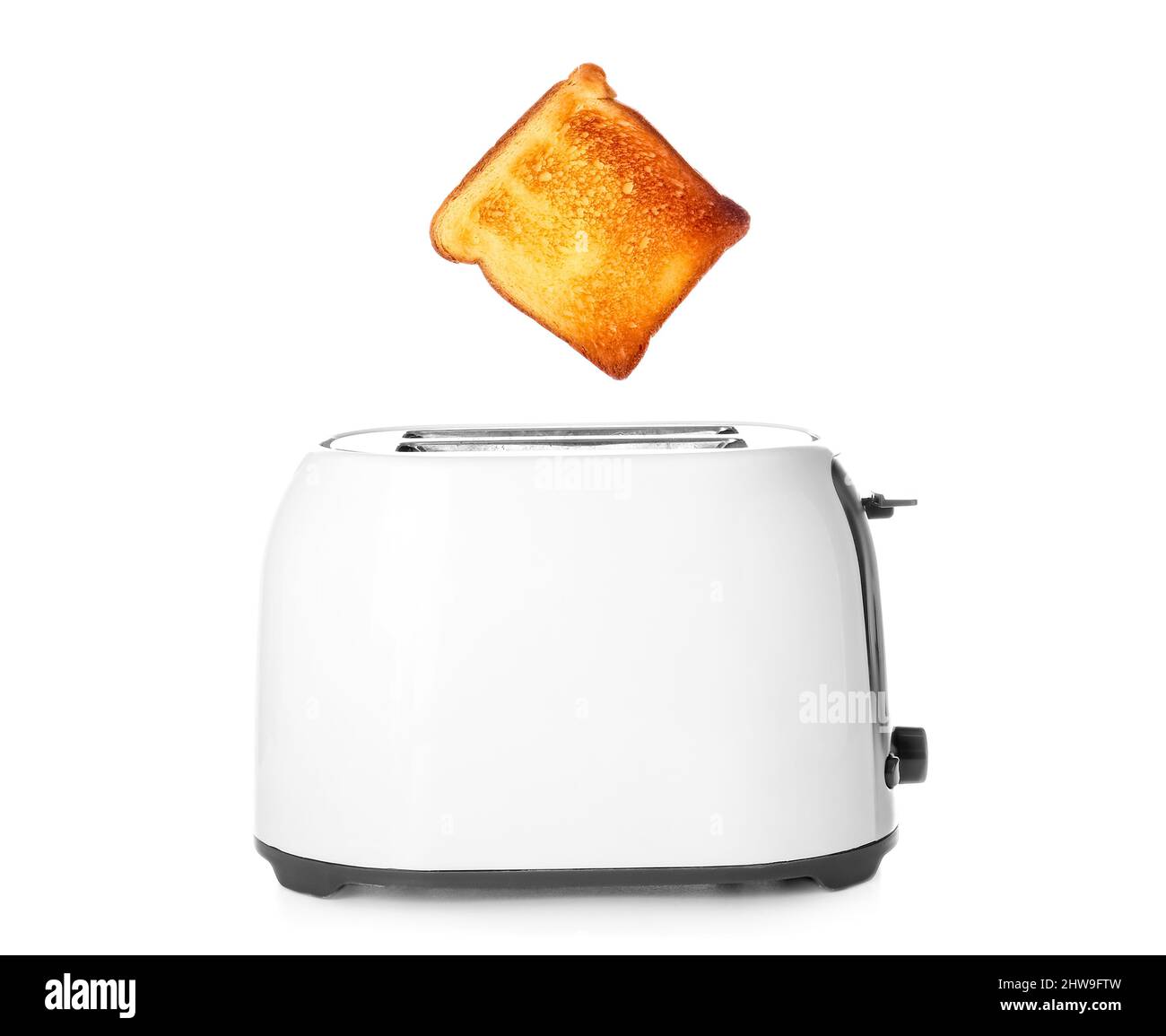Modern toaster with bread slice on white background Stock Photo - Alamy