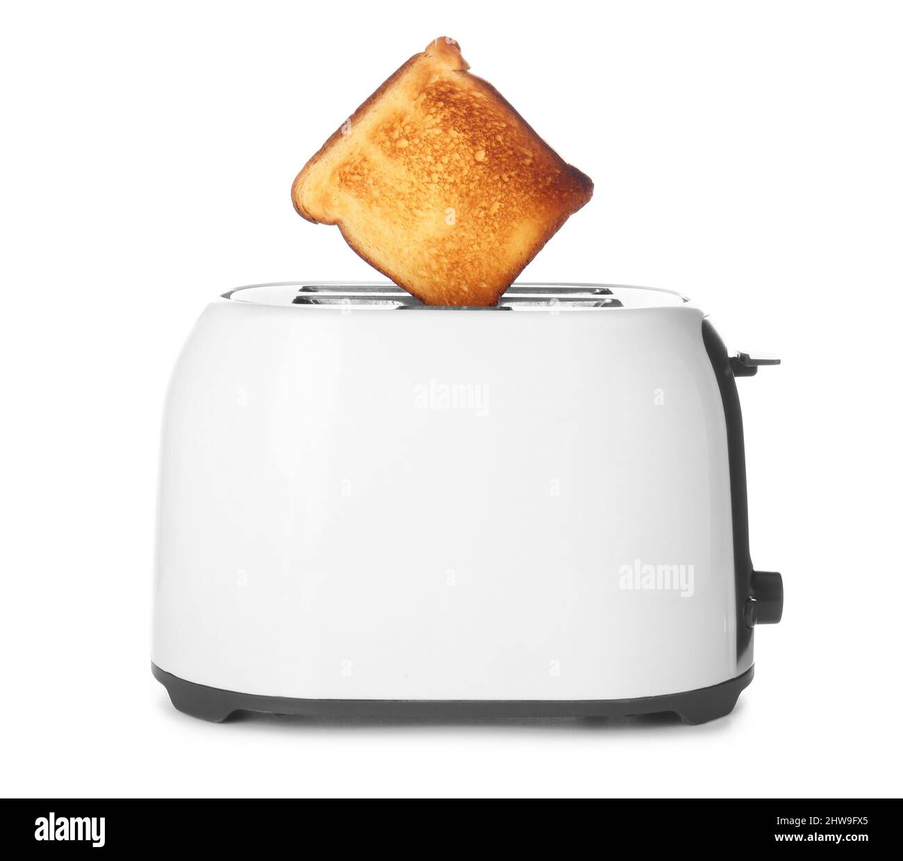 Modern toaster with bread slice on white background Stock Photo - Alamy