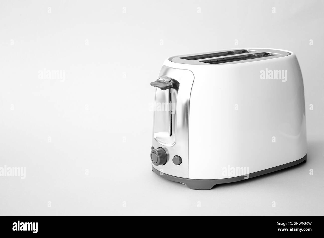 New modern toaster on white background Stock Photo - Alamy