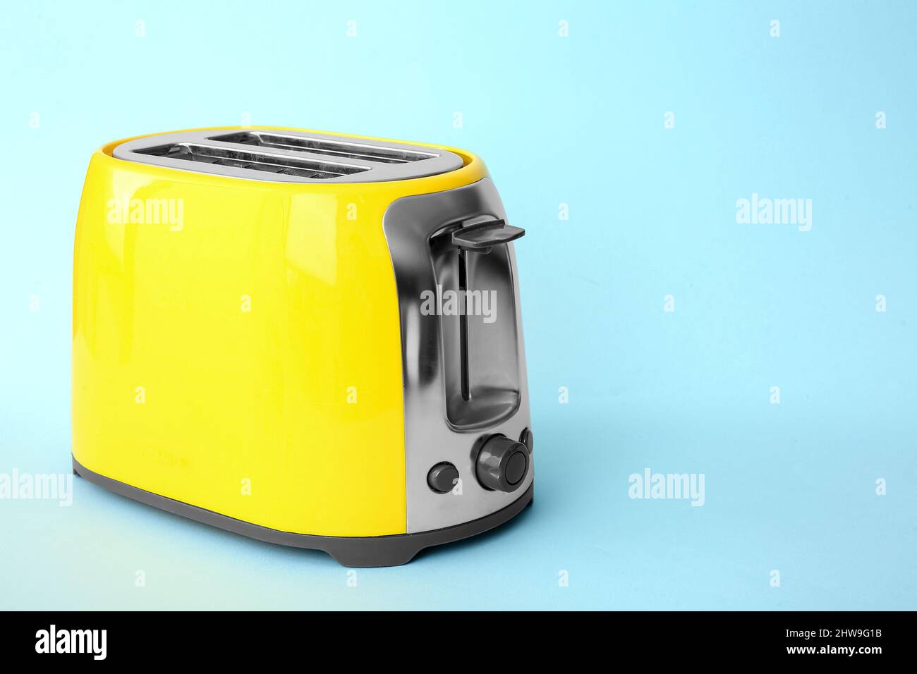 New modern toaster on blue background Stock Photo - Alamy