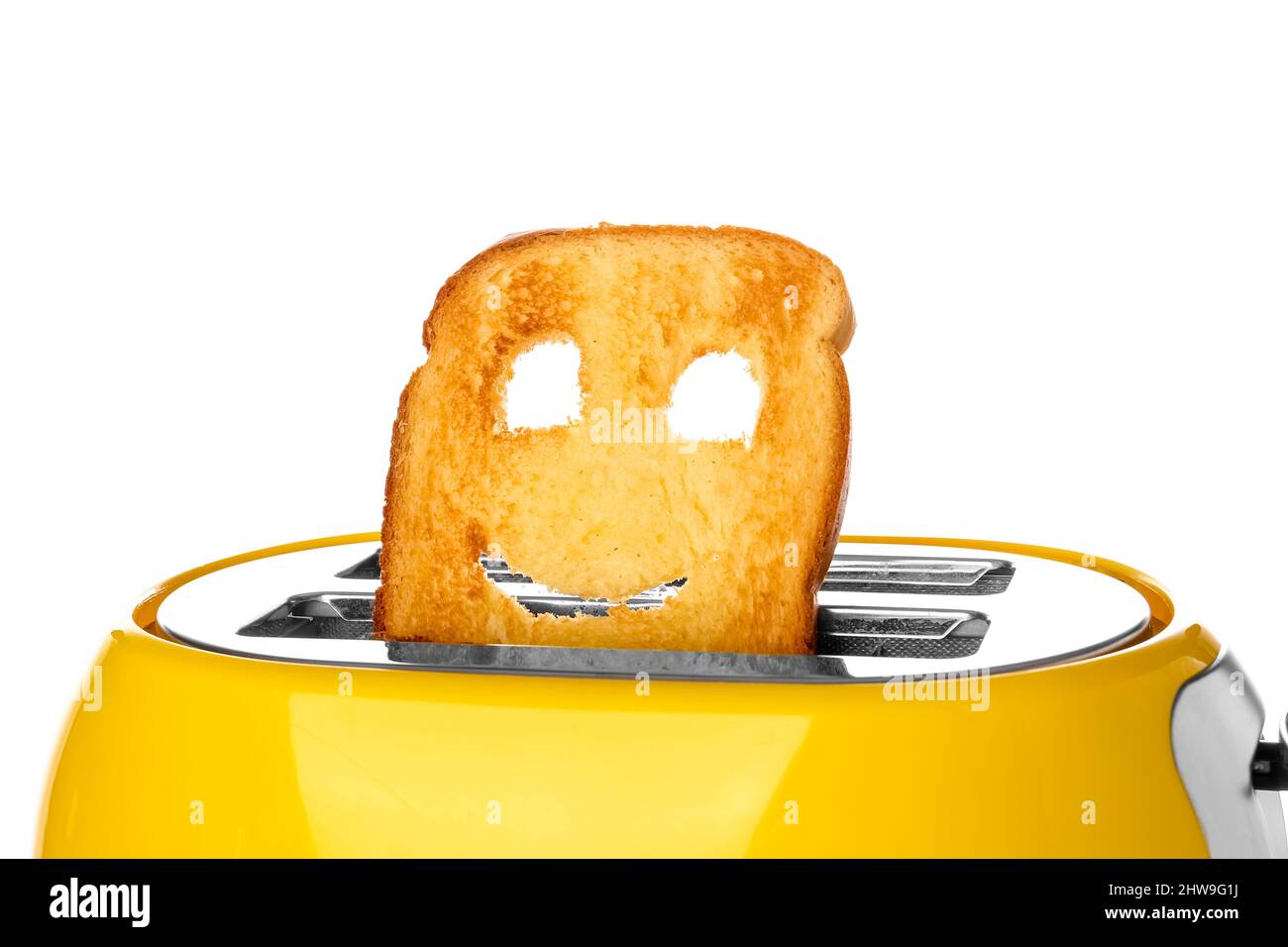 Funny slice of bread in toaster on white background, closeup Stock ...