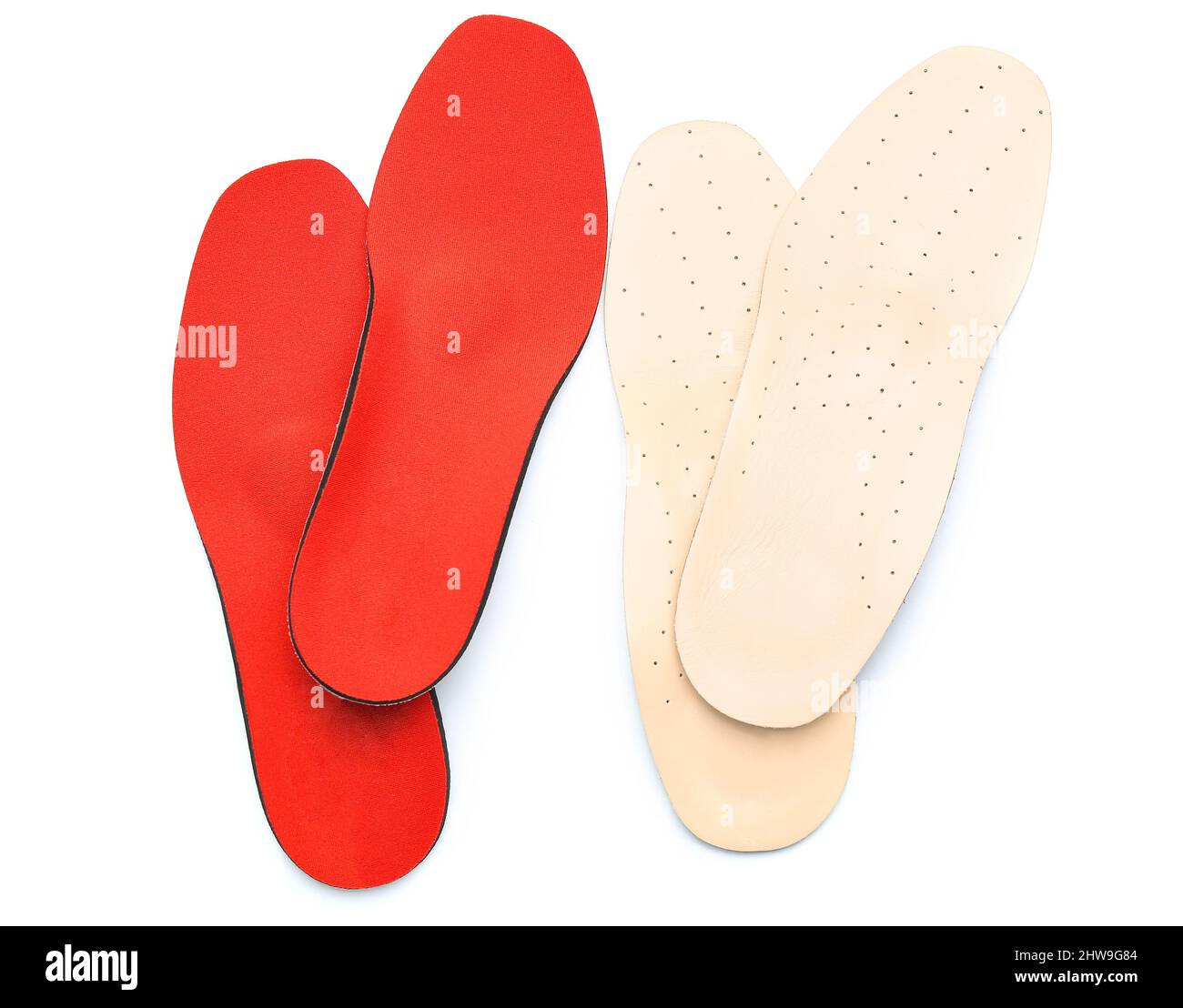 Two pairs of orthopedic insoles on white background Stock Photo - Alamy