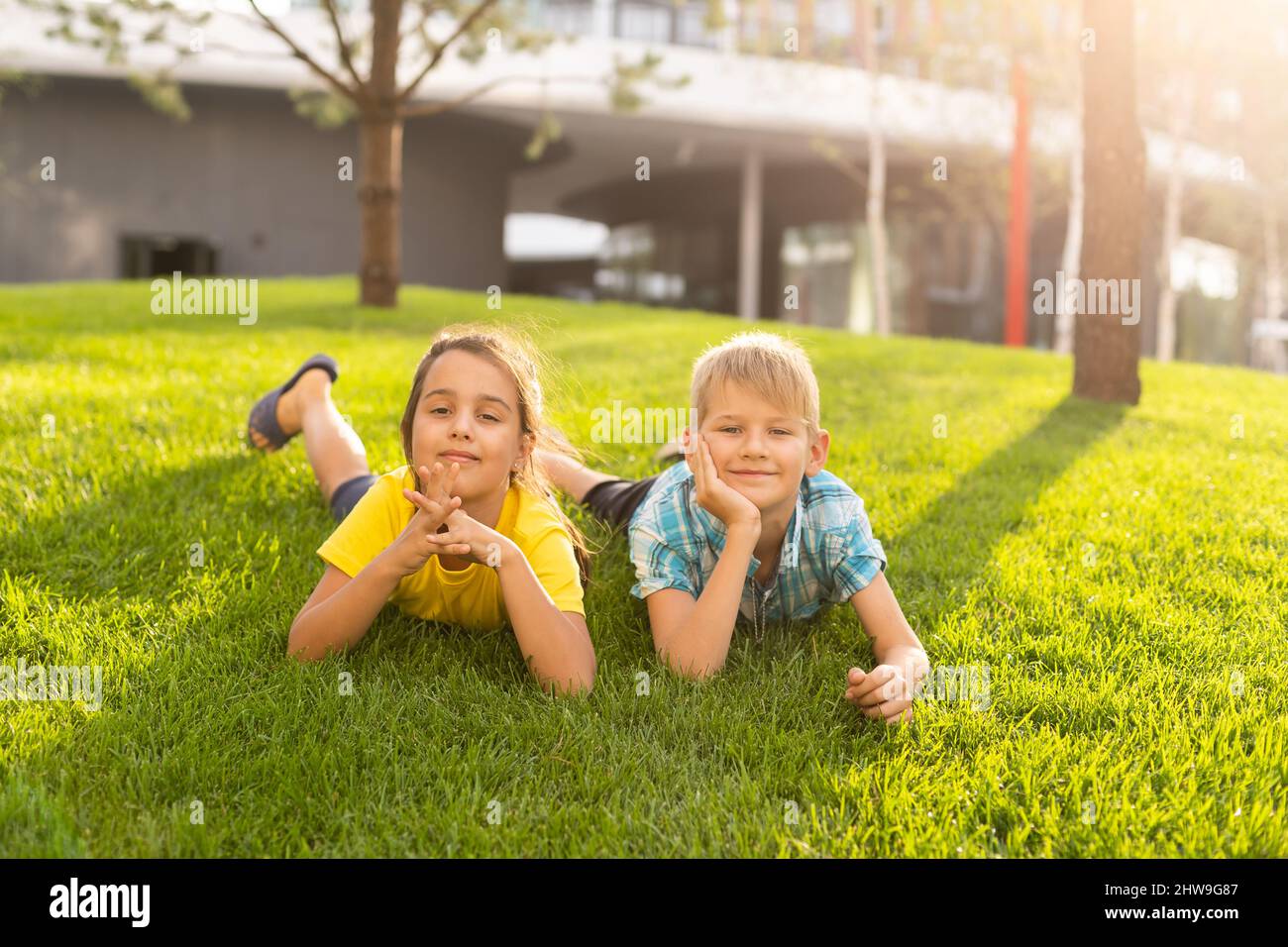 Portrait Of Excited Elementary School Pupils On Playing Field At Break ...