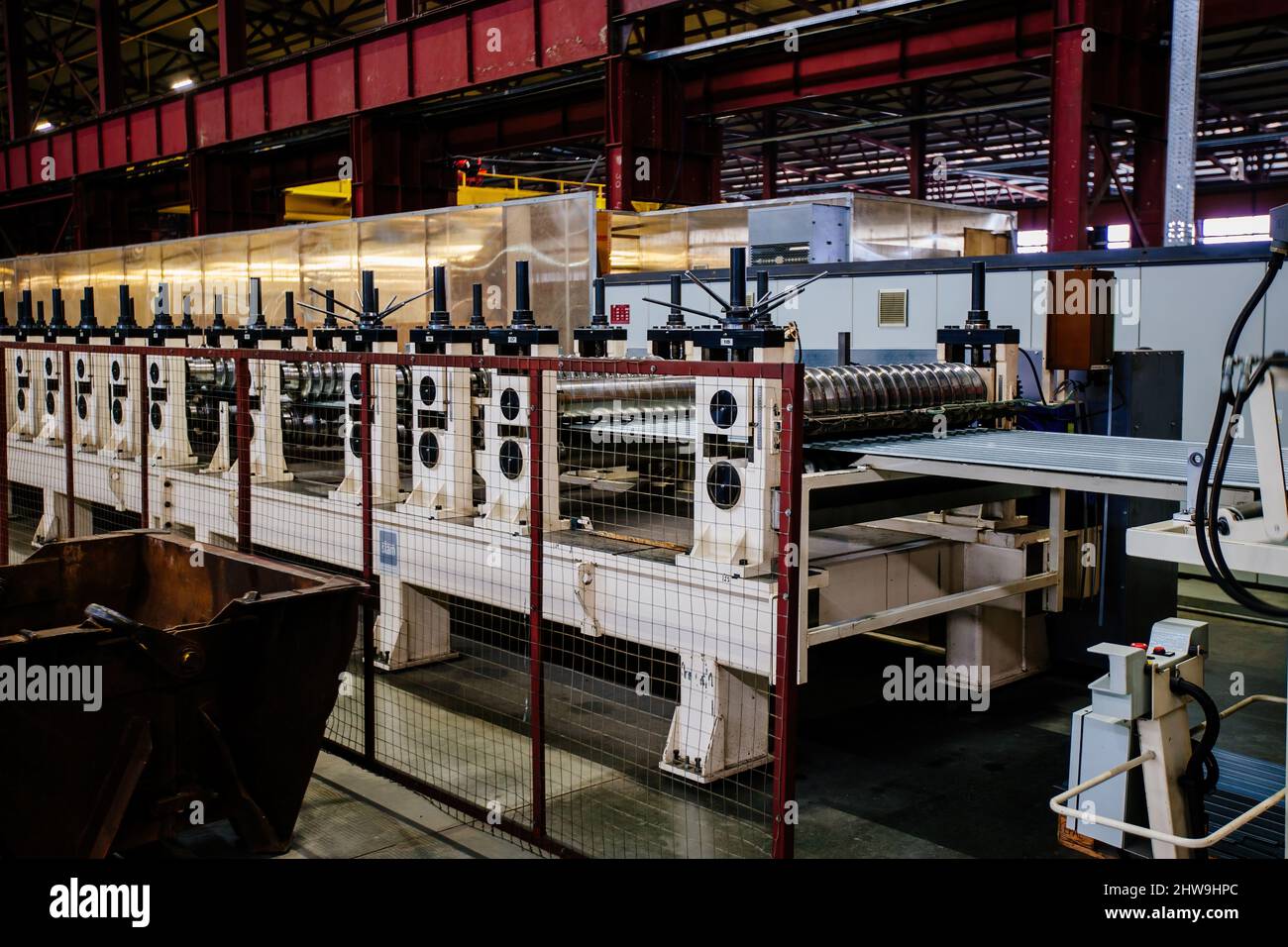 Metal profiling production line. Roll forming machine in workshop Stock ...