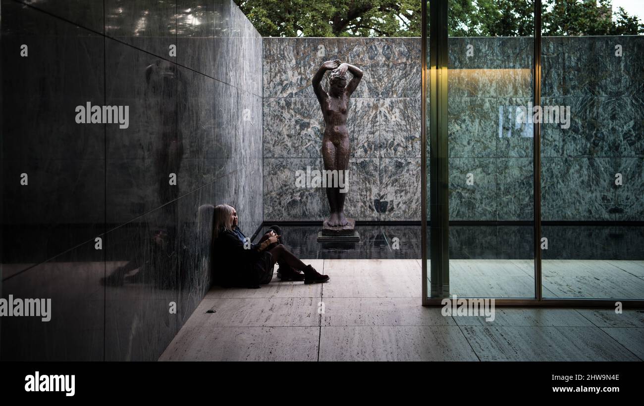 Couple sitting at the corner of Mies van der Rohe Pavilion Stock Photo ...