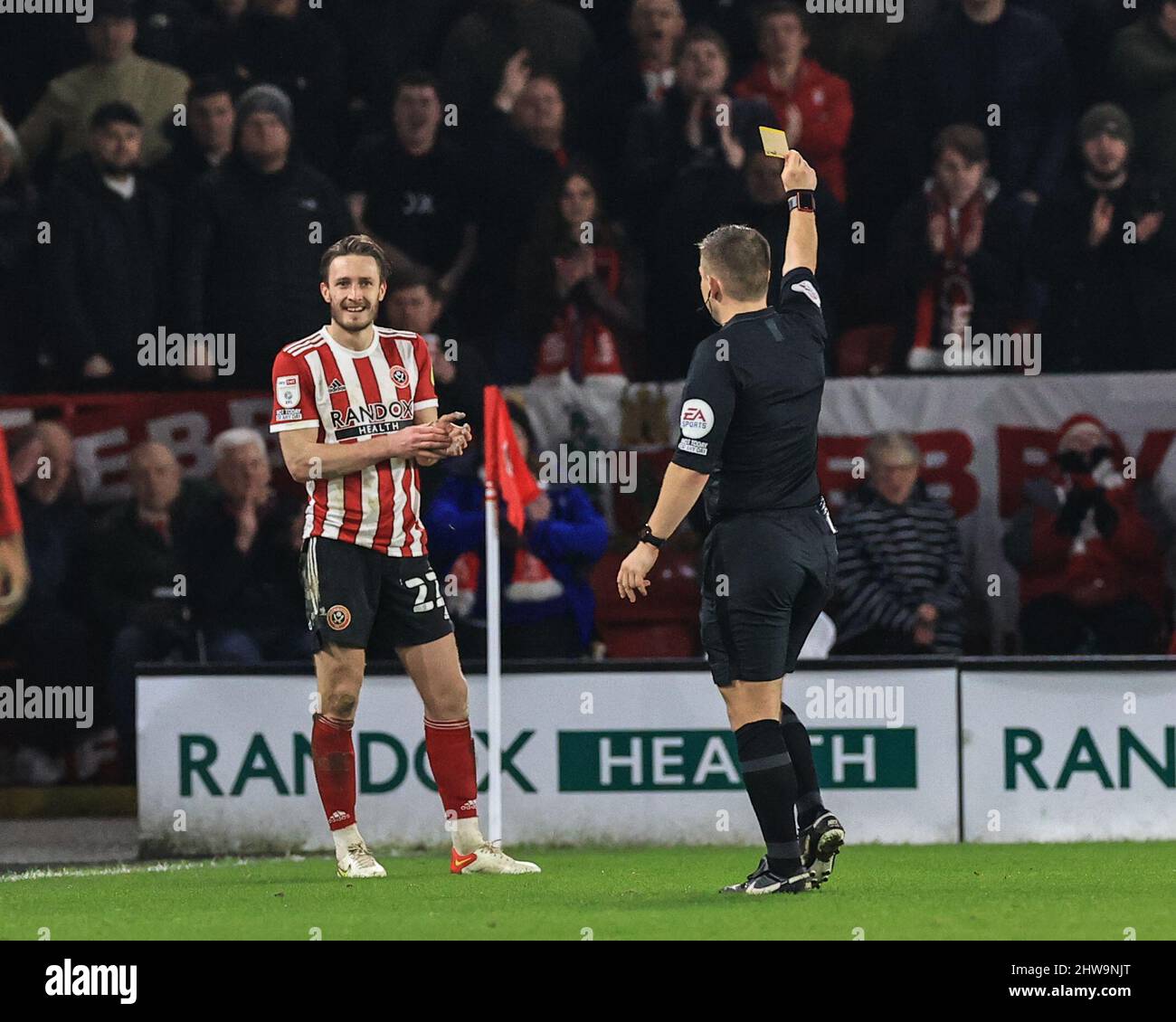 Referee Josh Smith gives a yellow card to Morgan Gibbs-White #27 of ...