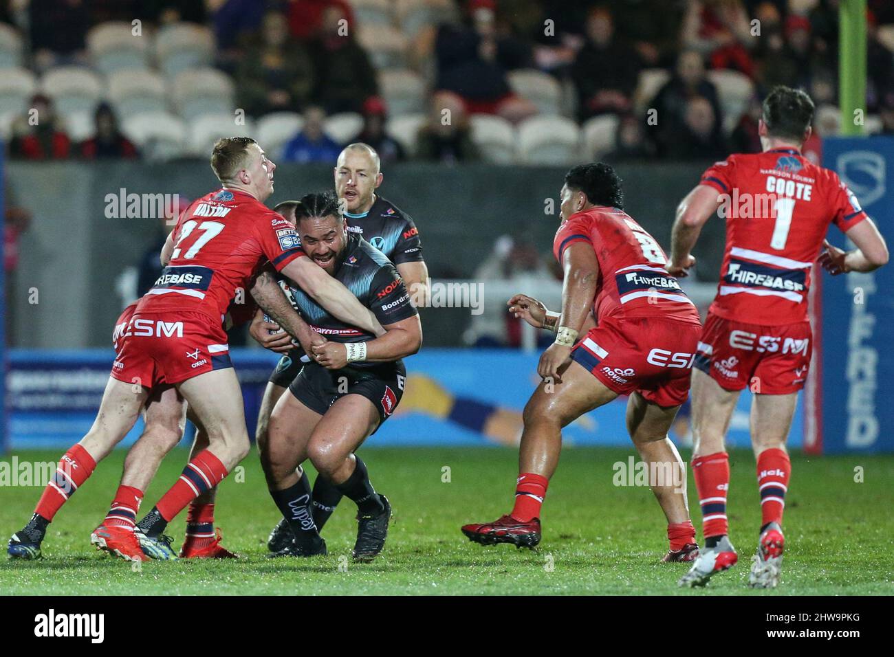 Konrad Hurrell (23) of St Helens runs at the Hull KR defence Stock ...