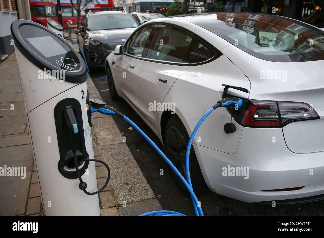 A Tesla electric car using an EV Charging Point in London. According to ...