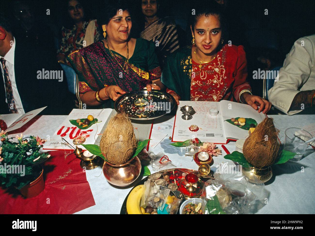 Women Holding Diya over Red Chopdis Performing Chopda Puja During ...