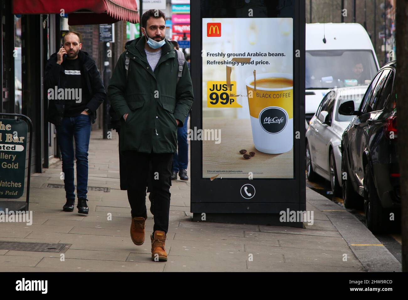 People walk past a McDonald's digital advert displayed in London Stock ...
