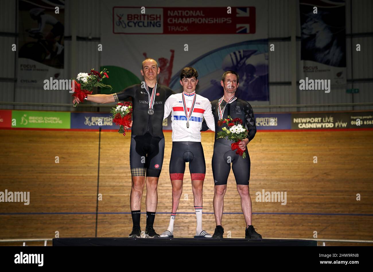 Finlay Graham (centre) receives his gold medal for the Para-Cycling C1 ...