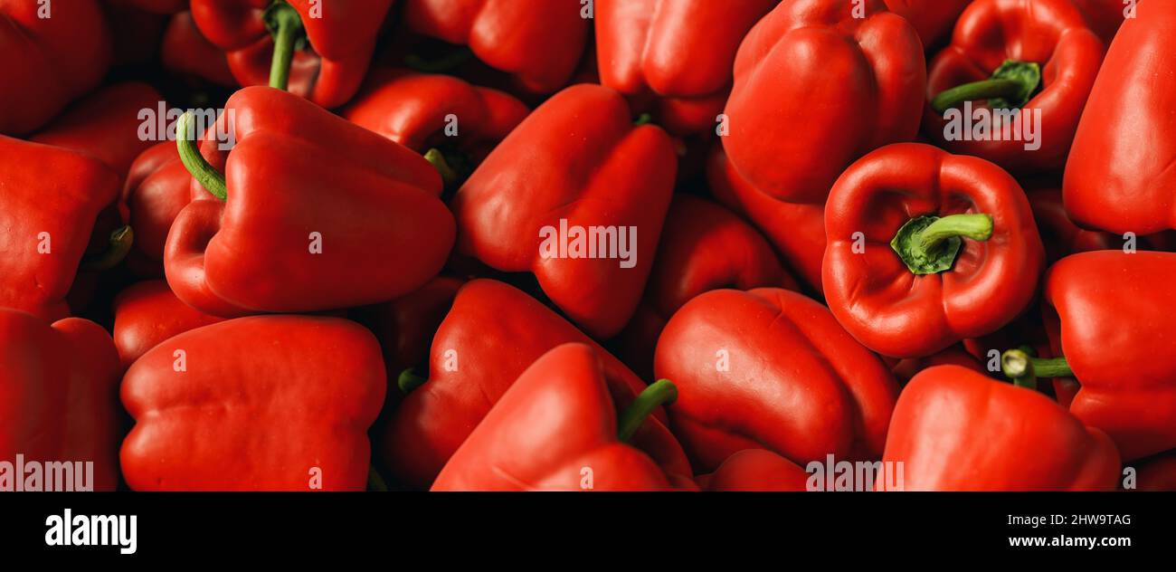 Pile of red paprika peppers as background, closeup Stock Photo - Alamy