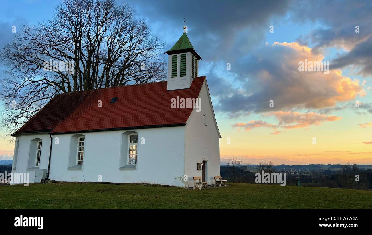 Beautiful view of an old chapel on a cloudy sky background Stock Photo ...