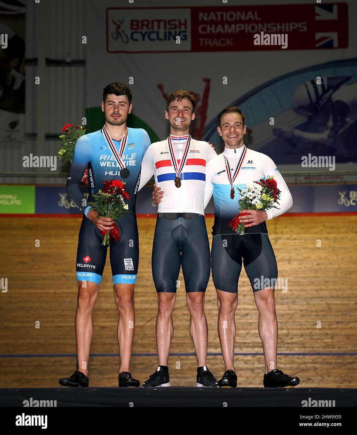 Daniel Bigham (centre) receives his gold medal for the Men’s 4000m ...