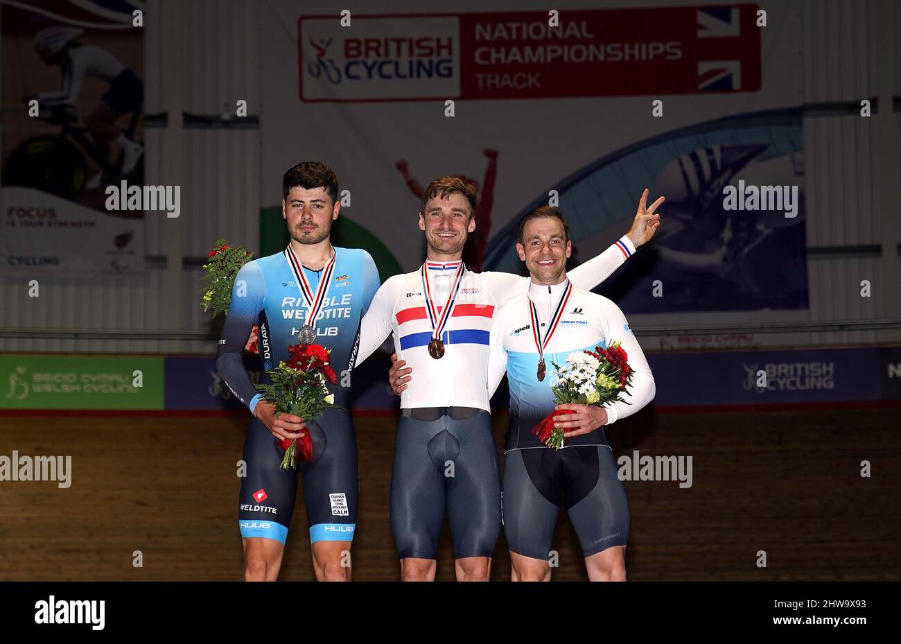 Daniel Bigham (centre) receives his gold medal for the Men’s 4000m ...