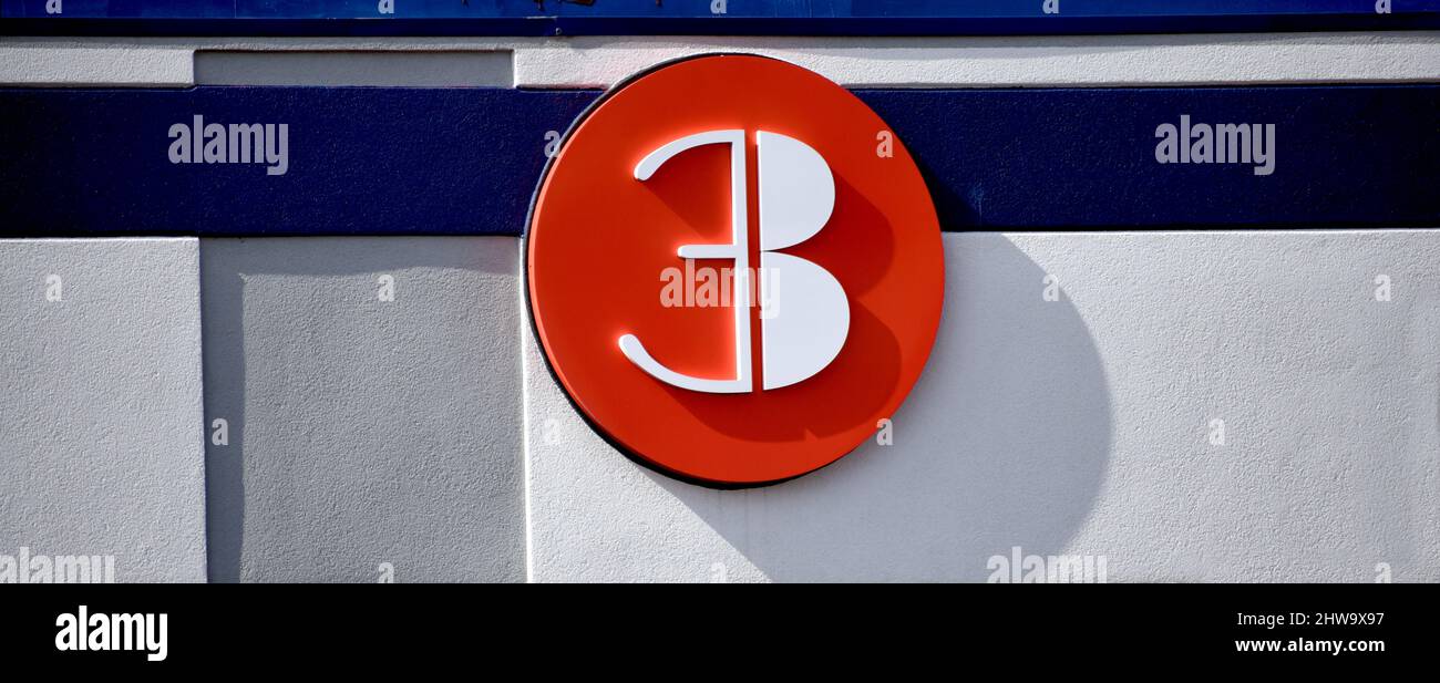 Building, with blue stripe, has a red circle displaying the number ...