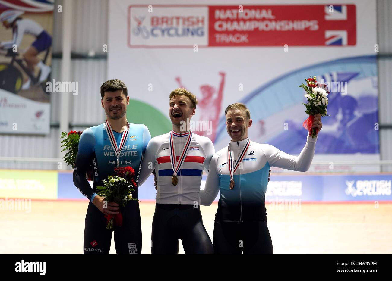 Daniel Bigham (centre) receives his gold medal for the Men’s 4000m ...